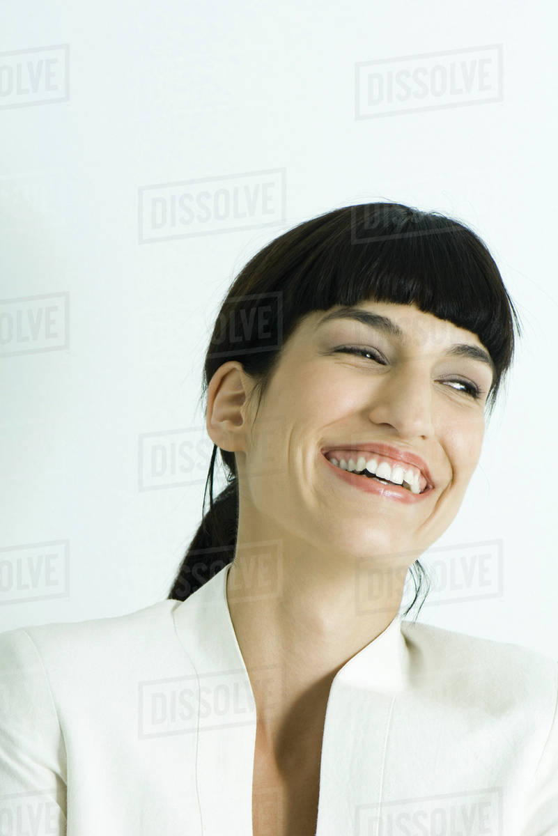 Woman laughing, head and shoulders, portrait - Stock Photo - Dissolve