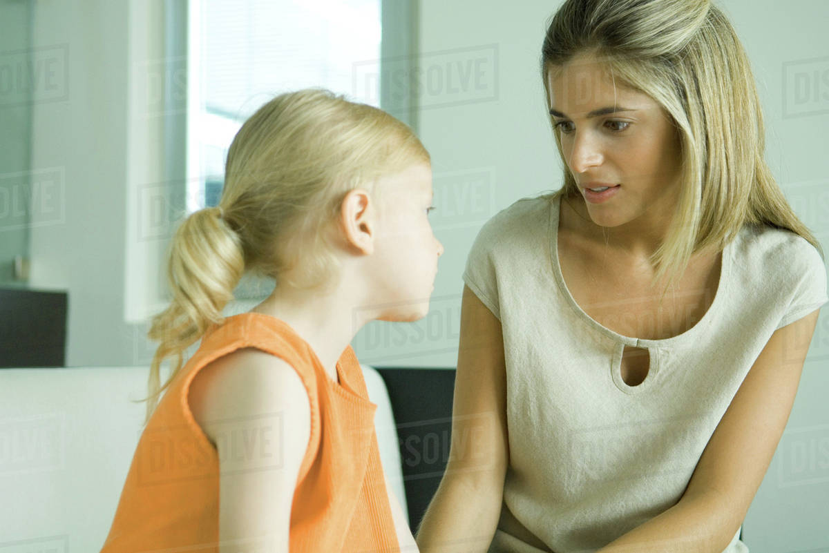 Mother and daughter talking together - Royalty-free Stock Photo | Dissolve