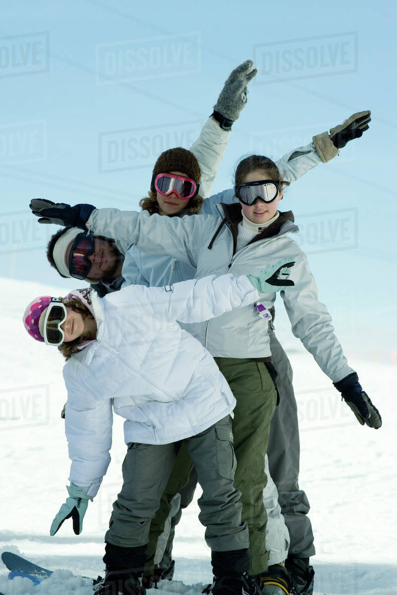 Young skiers standing on ski slope, full length portrait - Royalty-free ...