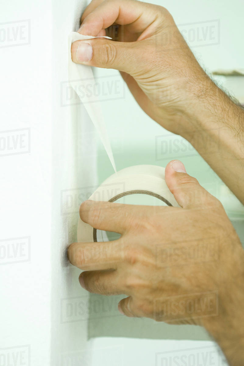 Man taping with adhesive tape, cropped view of hands - Royalty-free ...