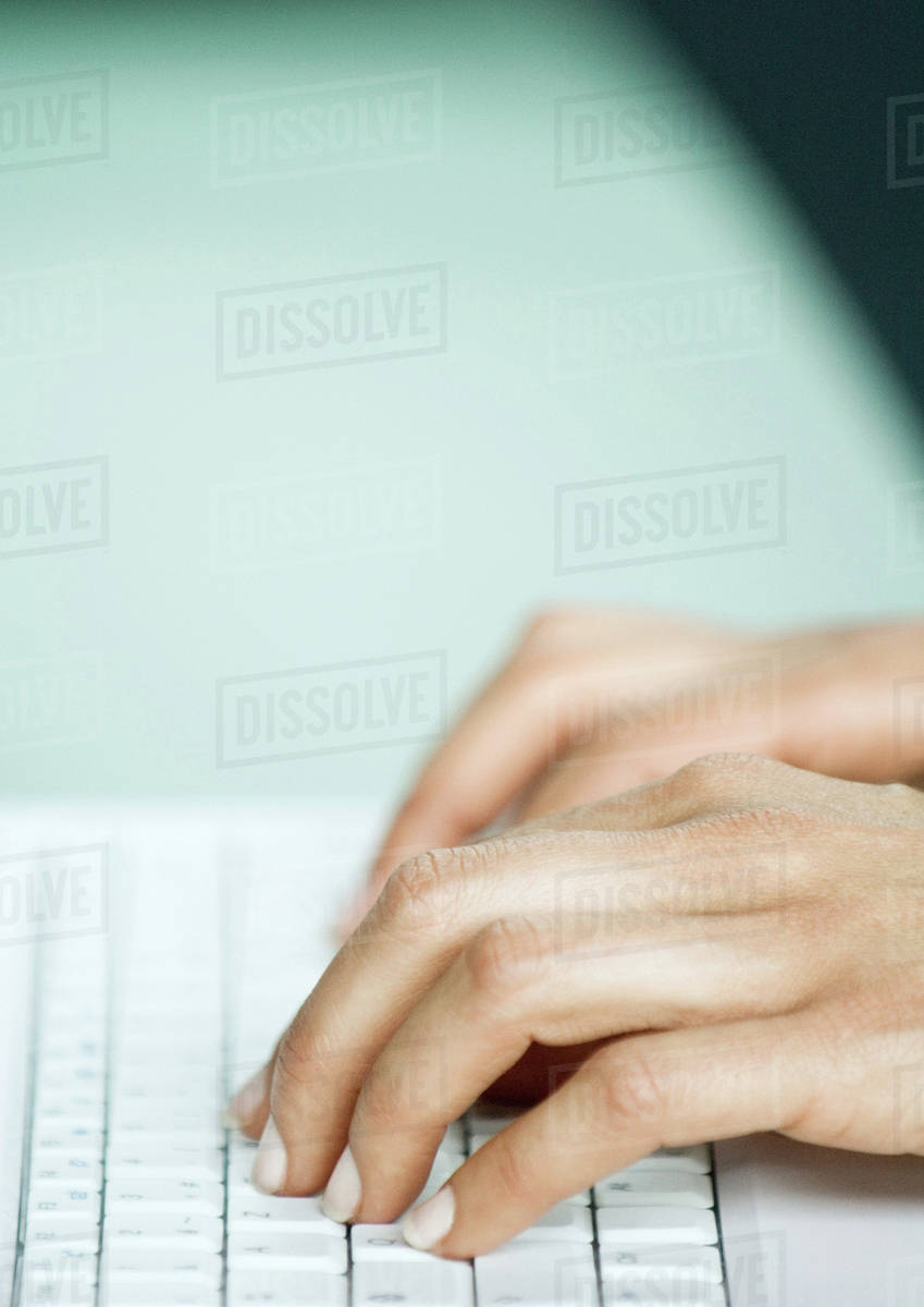 Woman's hands on computer keyboard - Royalty-free Stock Photo | Dissolve