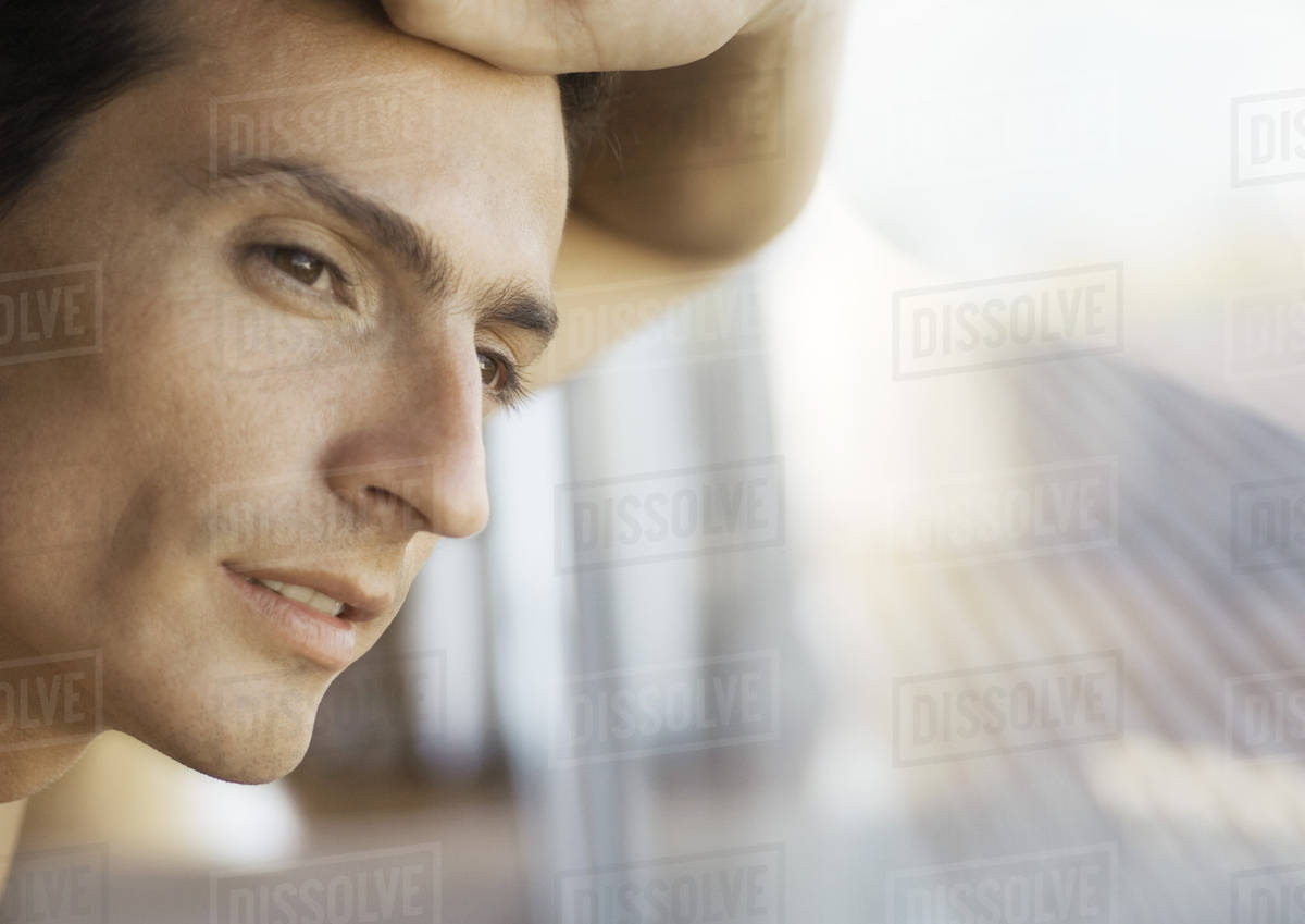 Man's face looking into distance - Stock Photo - Dissolve