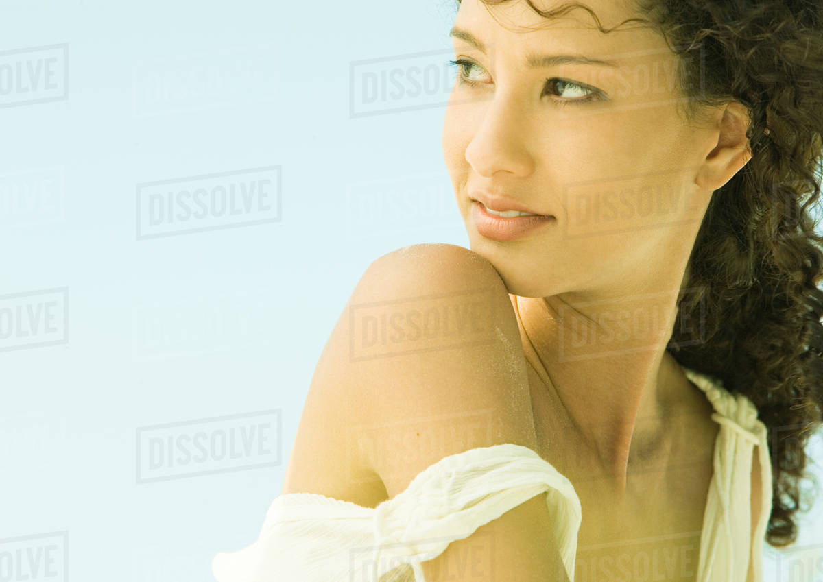 Woman looking over shoulder - Royalty-free Stock Photo | Dissolve