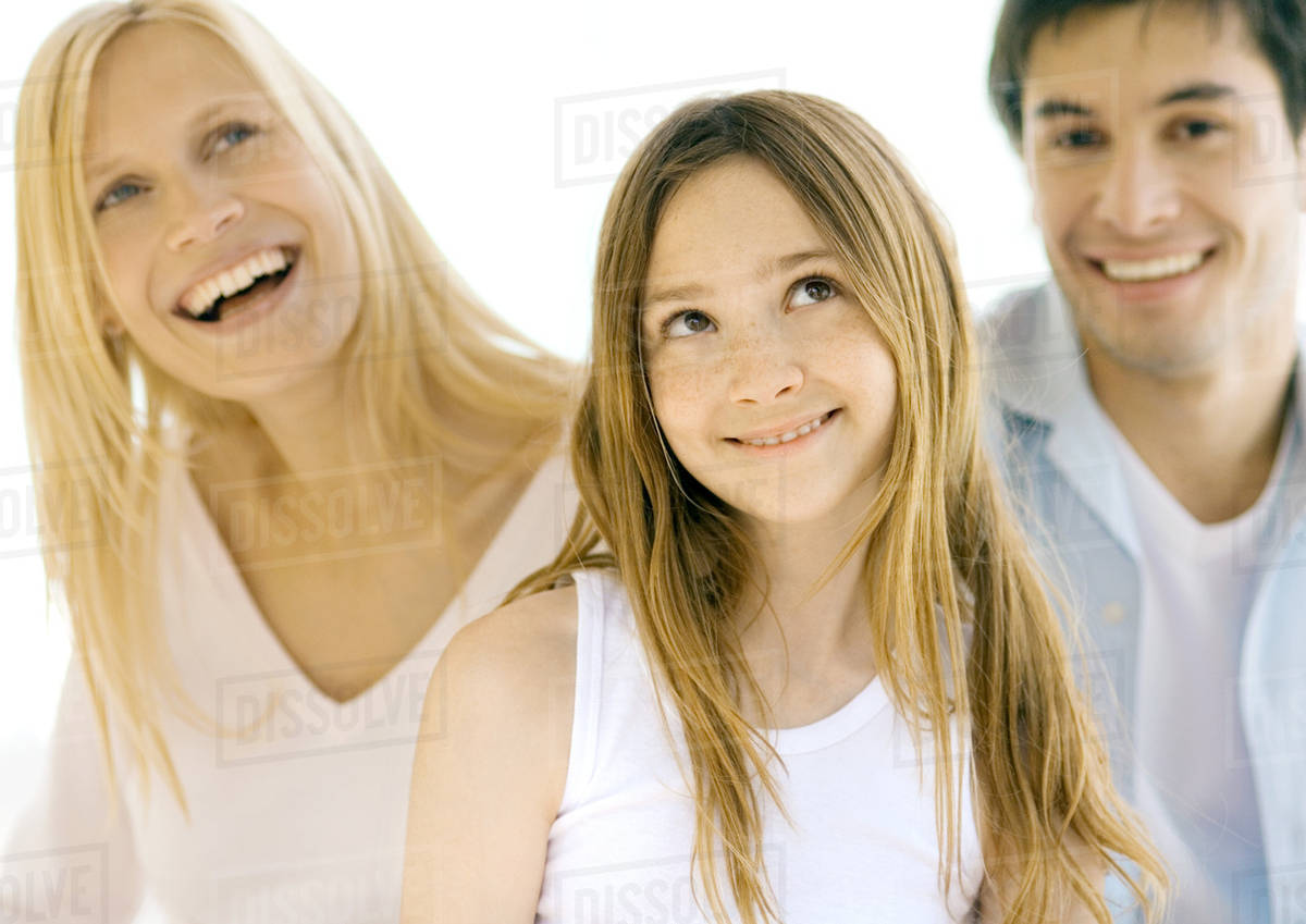 Girl with parents, portrait - Royalty-free Stock Photo | Dissolve