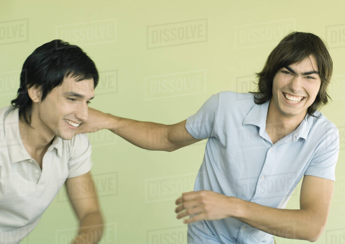 Two young men laughing - Royalty-free Stock Photo | Dissolve