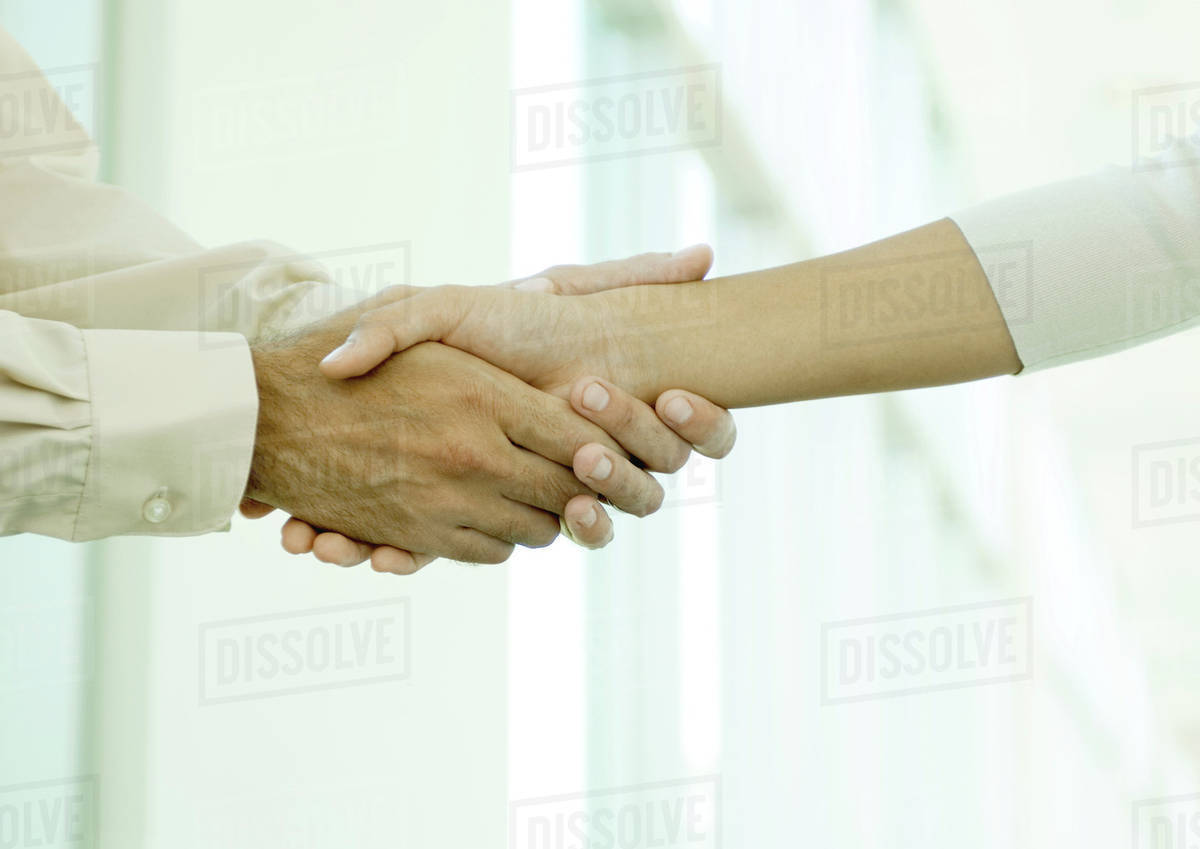 Man clasping woman's hand, close-up - Royalty-free Stock Photo | Dissolve