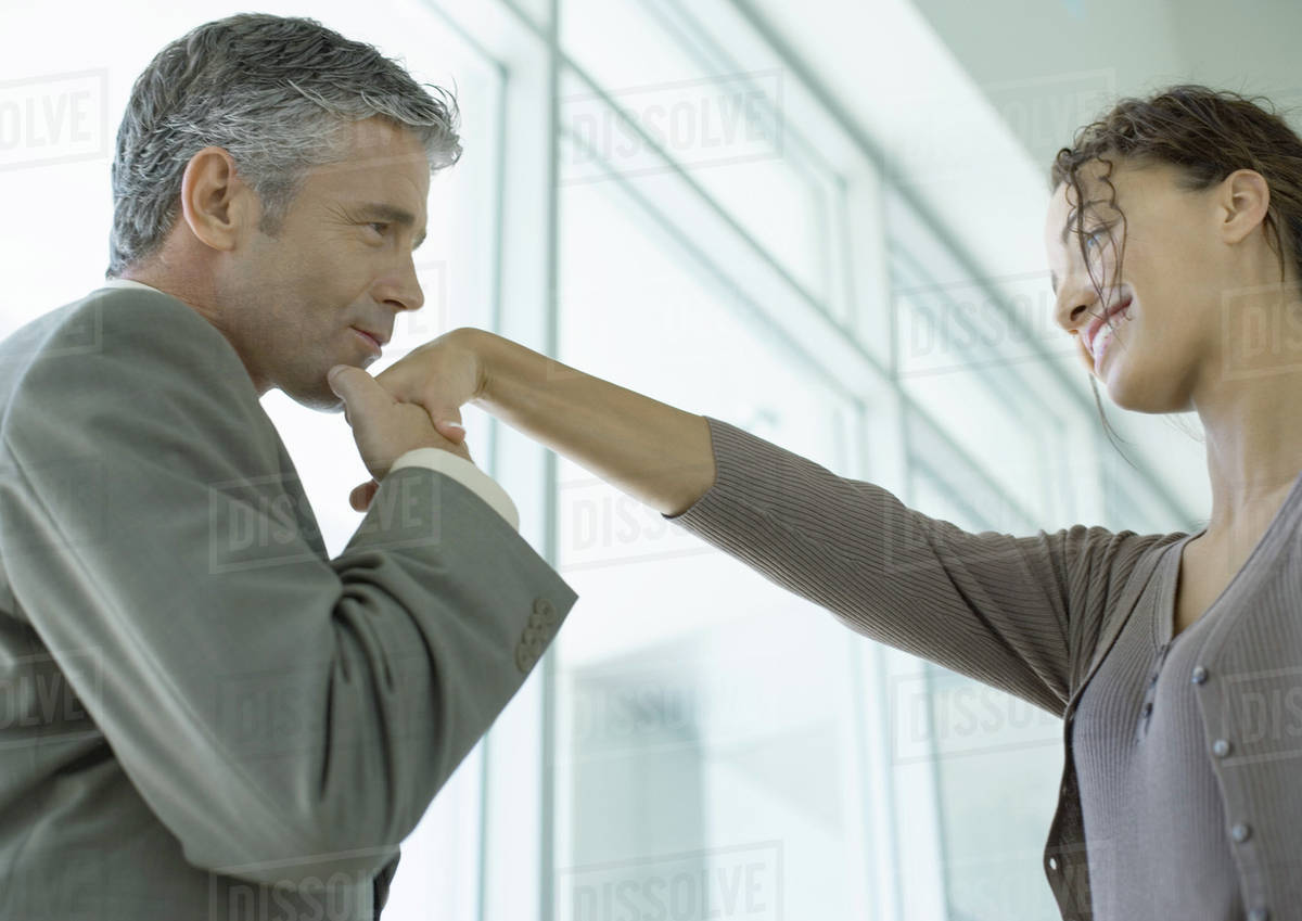 Man kissing woman's hand - Royalty-free Stock Photo | Dissolve