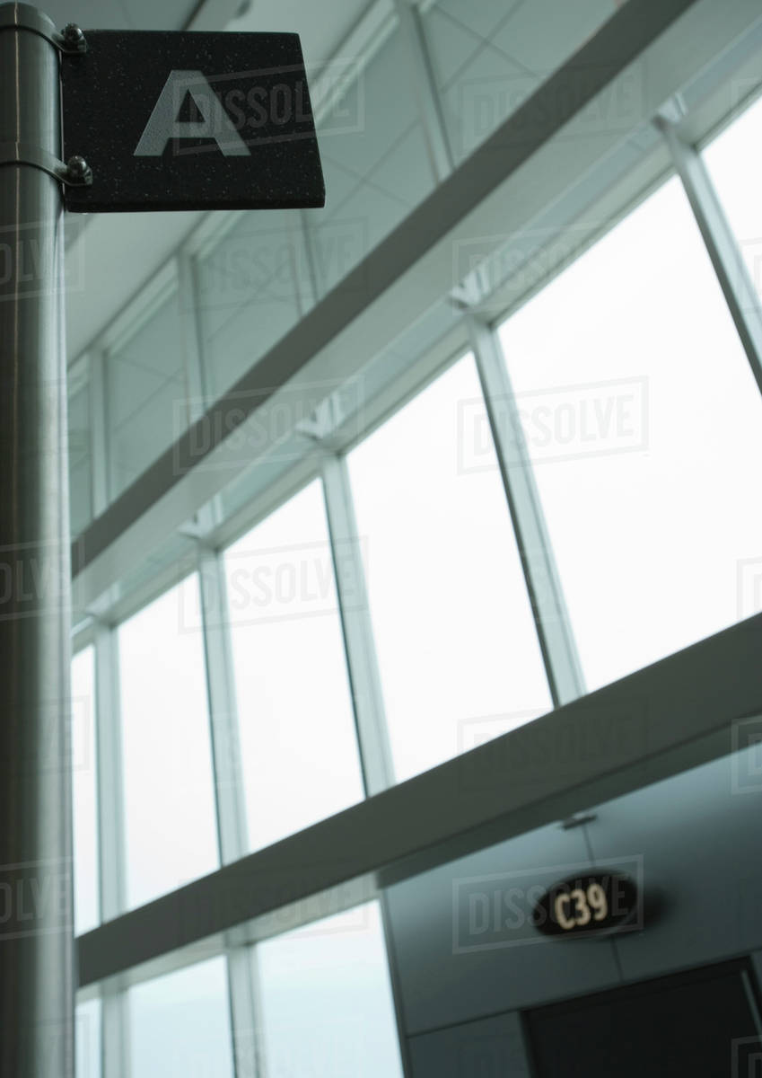 Airport interior: sign with letter "A" and boarding gate - Stock Photo ...