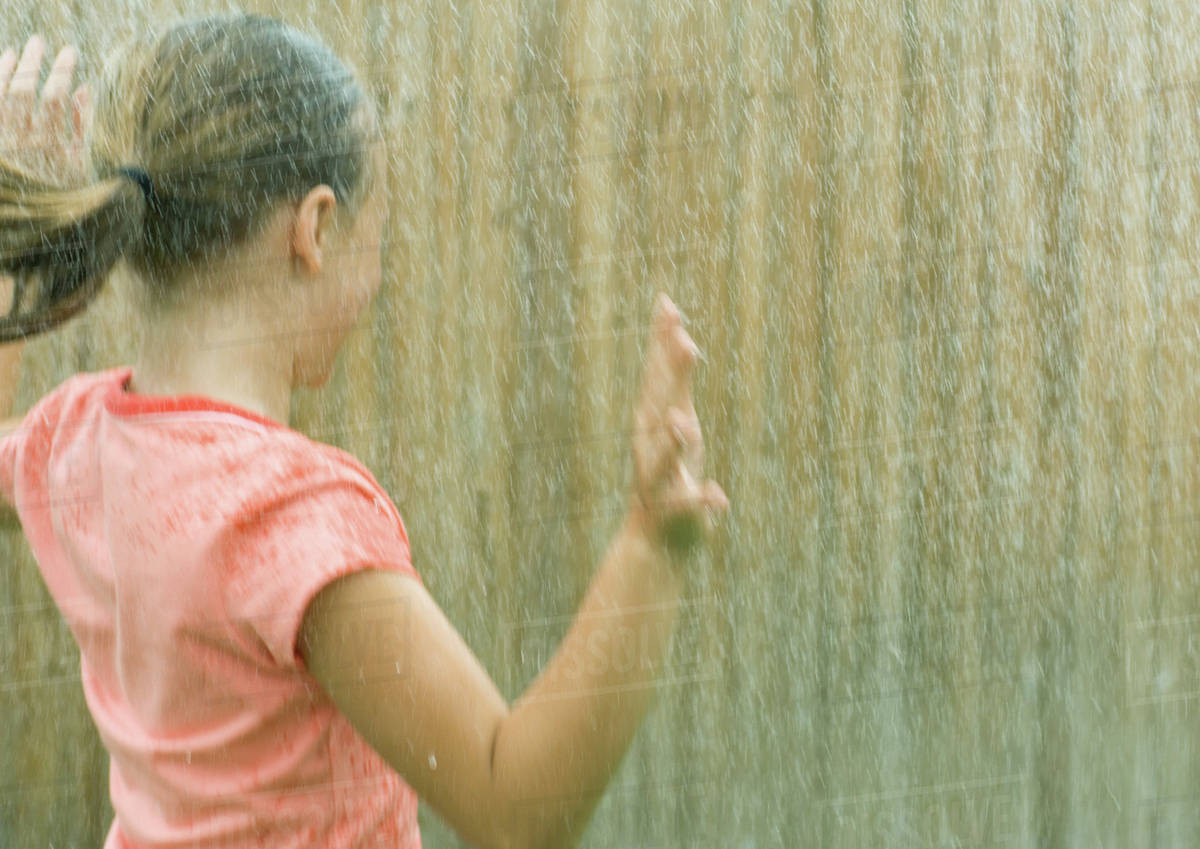 Girl getting wet - Stock Photo - Dissolve