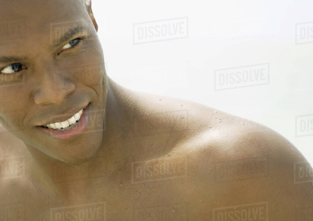 Barechested man, smiling - Royalty-free Stock Photo | Dissolve