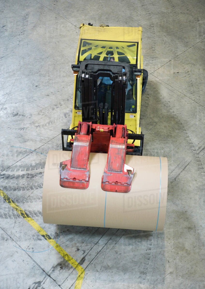 Forklift transporting roll of paper in warehouse - Royalty-free Stock ...