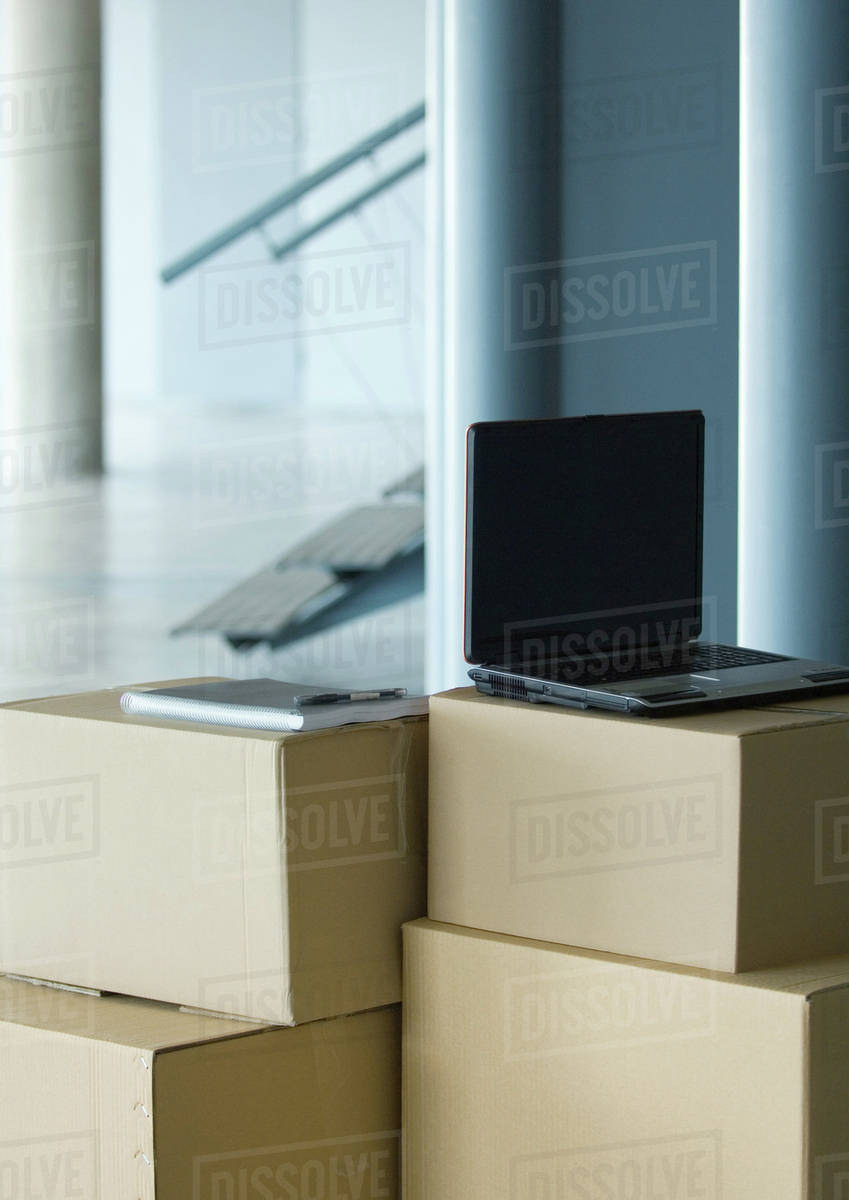Laptop on top of stack of cardboard boxes - Royalty-free Stock Photo ...