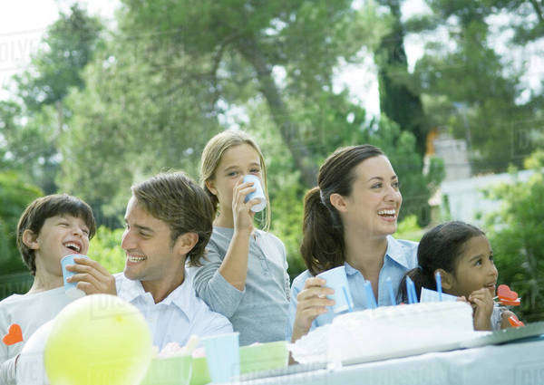 Family having outdoor birthday party - Royalty-free Stock Photo | Dissolve