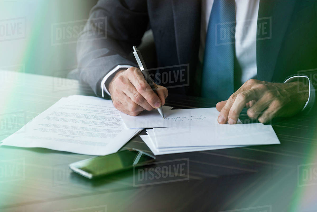 Lawyer writing letter - Stock Photo - Dissolve