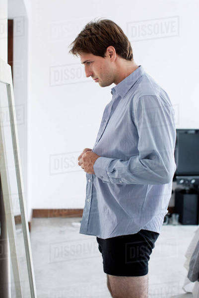 Man getting dressed - Royalty-free Stock Photo | Dissolve