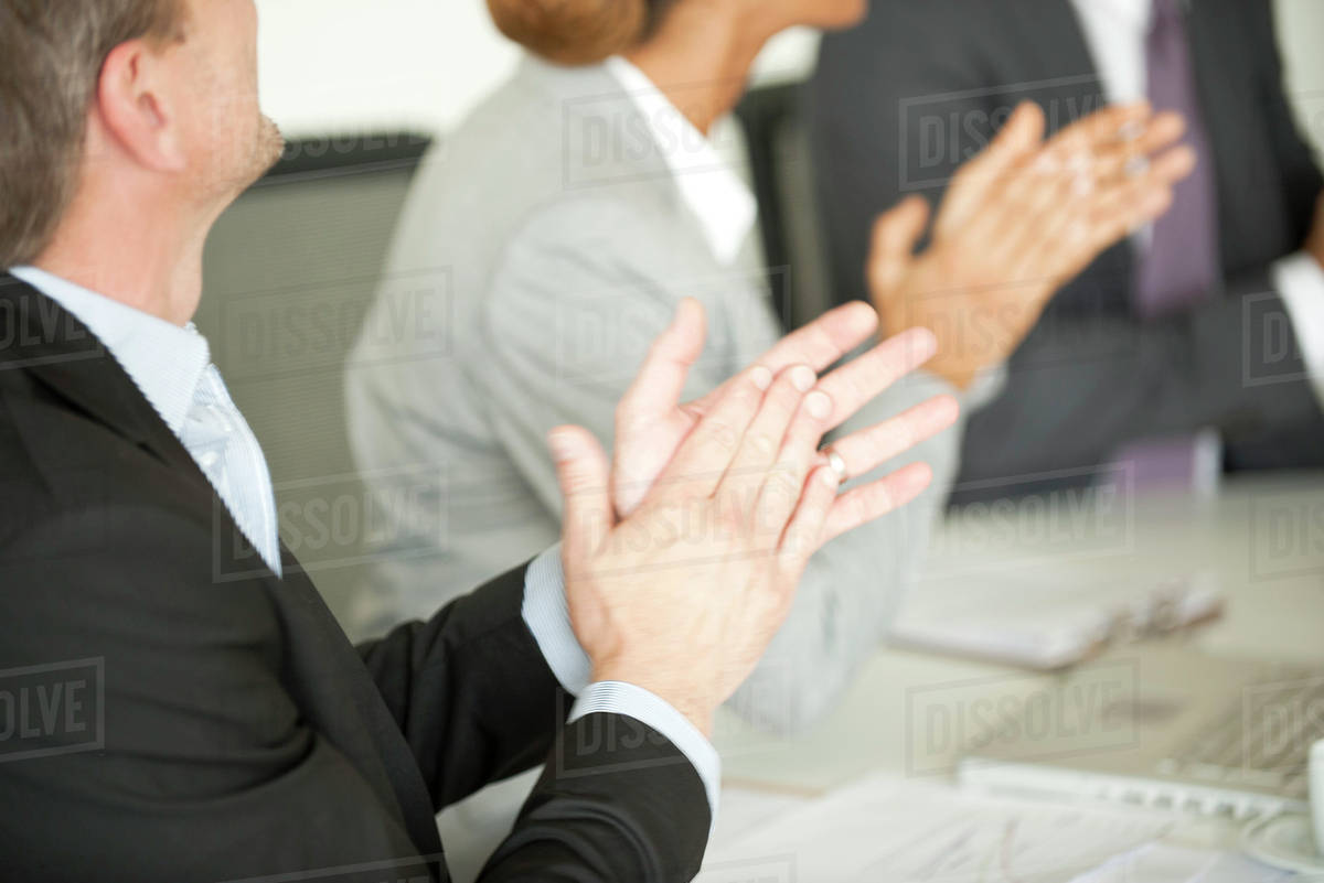 Executives clapping in meeting - Royalty-free Stock Photo | Dissolve