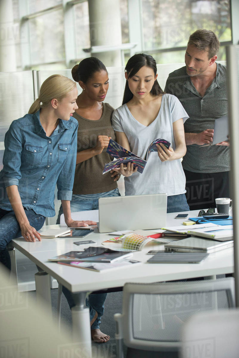 Office workers collaborating on project - Royalty-free Stock Photo ...
