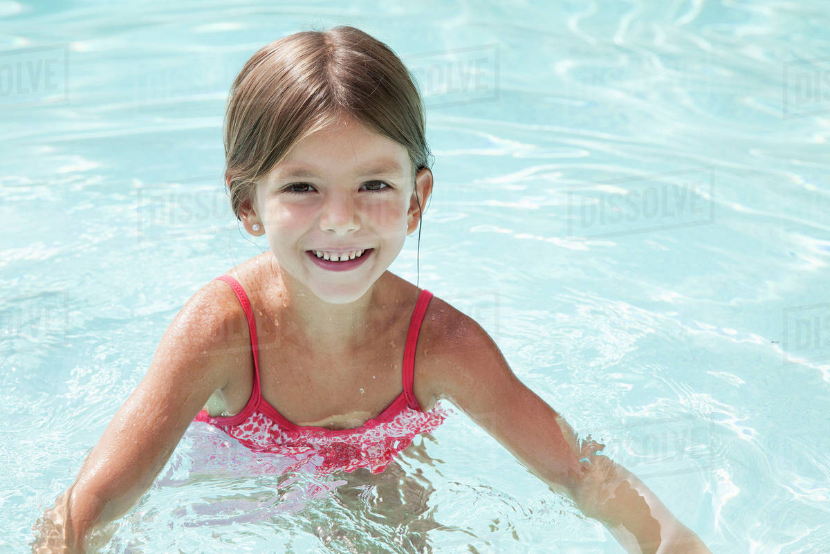Girl swimming in pool, portrait - Royalty-free Stock Photo | Dissolve