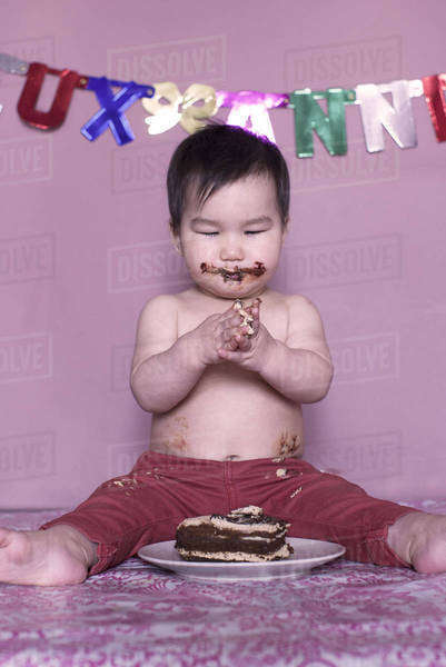 Baby eating birthday cake - Royalty-free Stock Photo | Dissolve