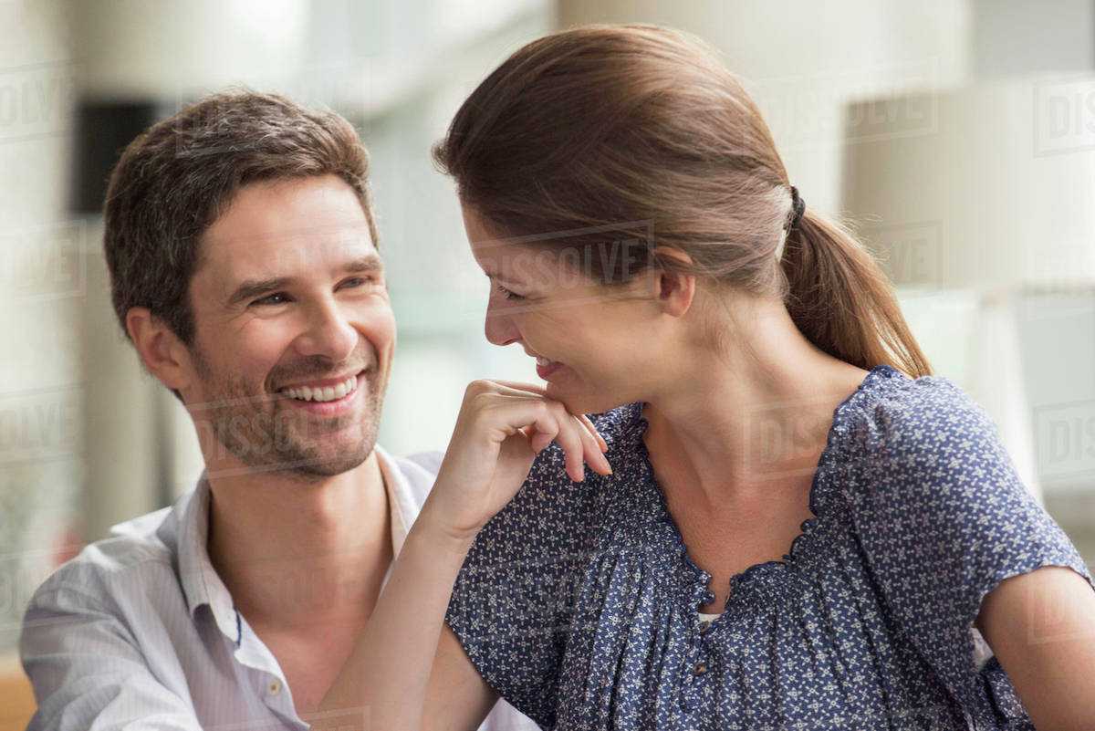 Couple smiling together at home - Royalty-free Stock Photo | Dissolve