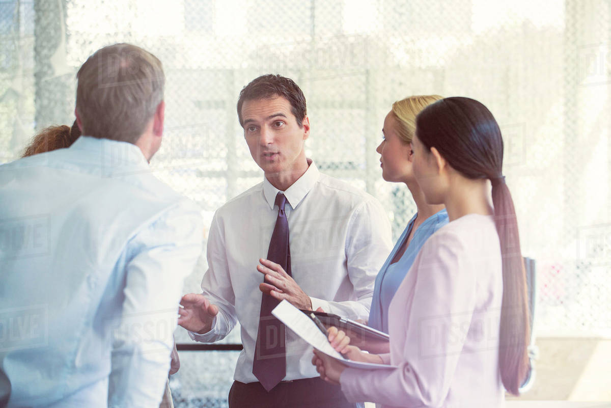 Supervisor explaining instructions to employees - Royalty-free Stock ...