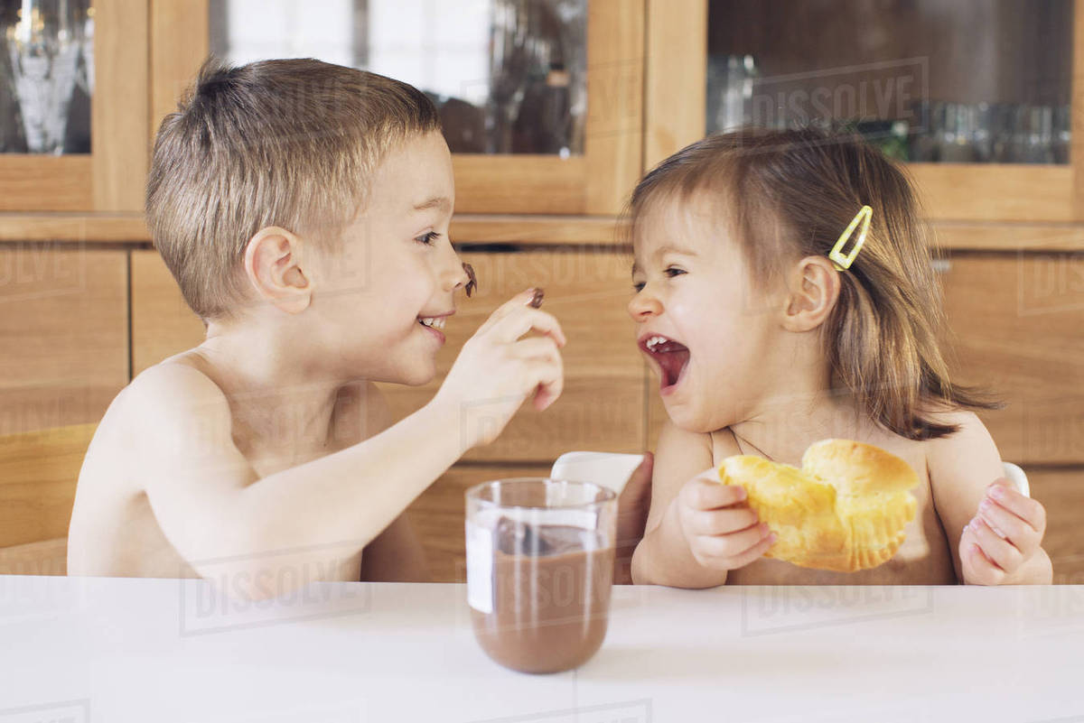 Siblings playing with chocolate spread - Royalty-free Stock Photo ...