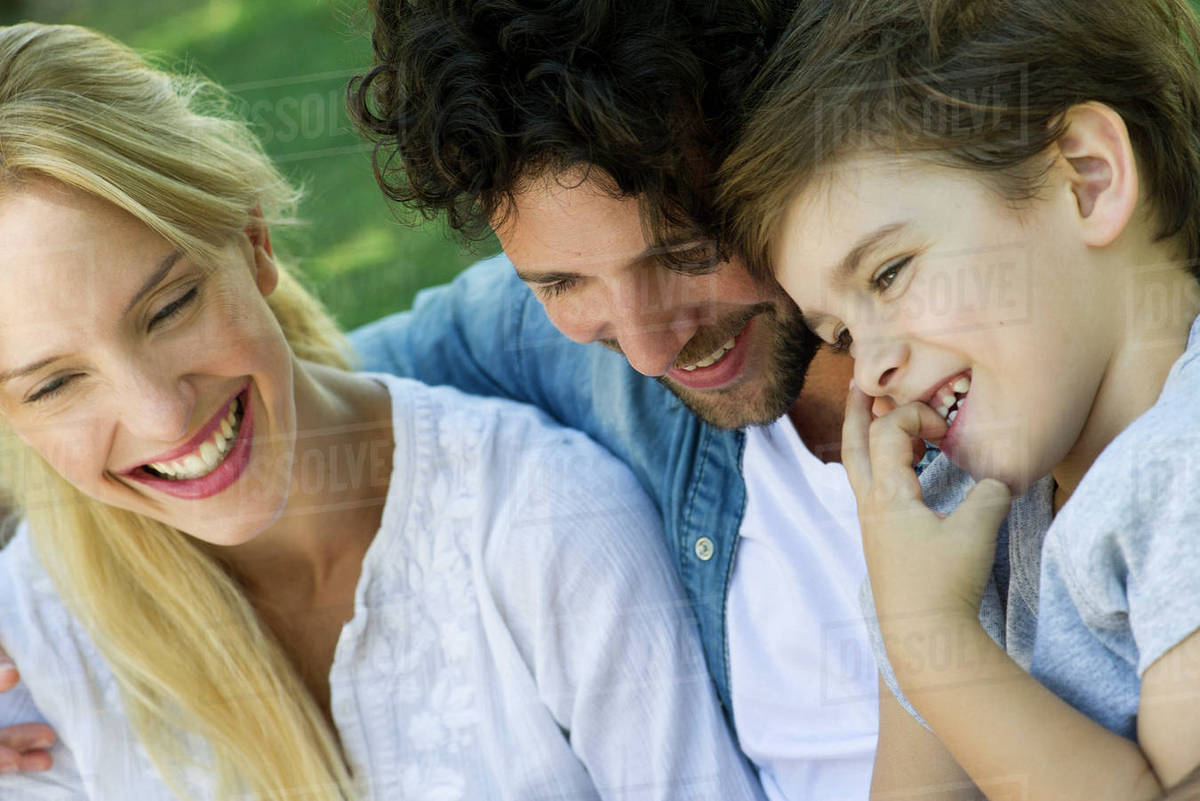 Family with one child, portrait - Stock Photo - Dissolve