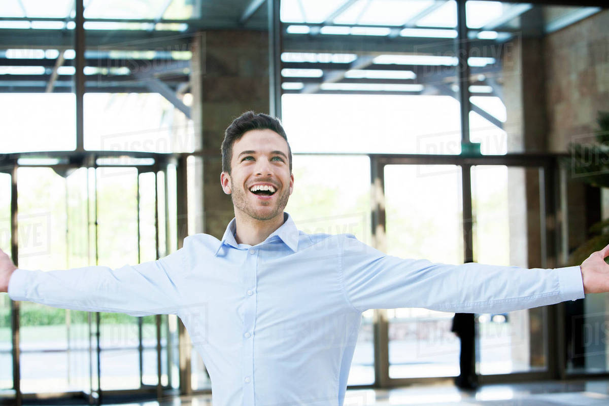 Man with arms outstretched - Royalty-free Stock Photo | Dissolve
