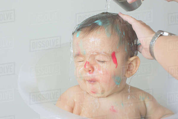 Baby being bathed - Royalty-free Stock Photo | Dissolve