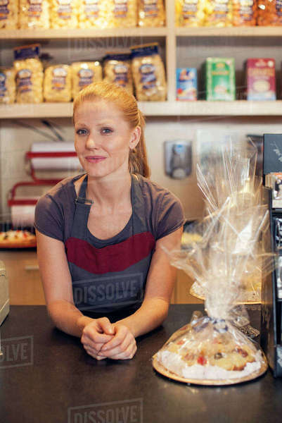 Friendly shopkeeper, portrait - Royalty-free Stock Photo | Dissolve