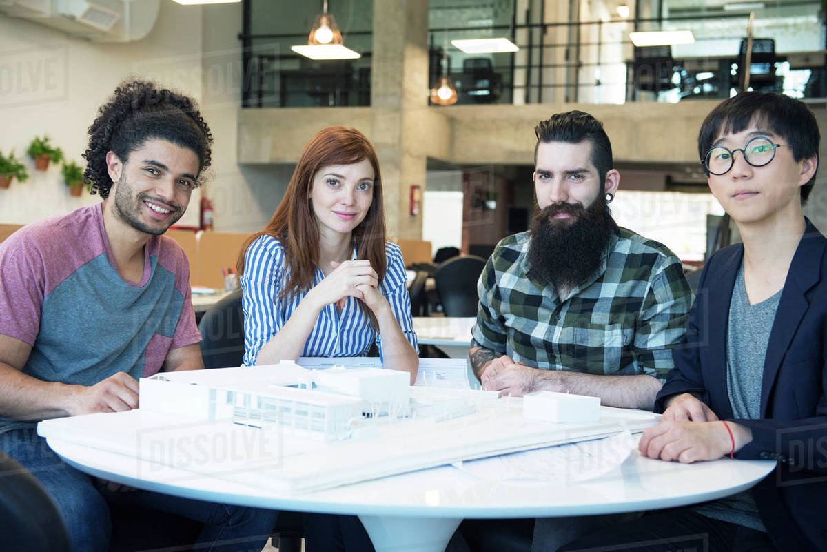 Team of architects with building model, portrait - Royalty-free Stock ...