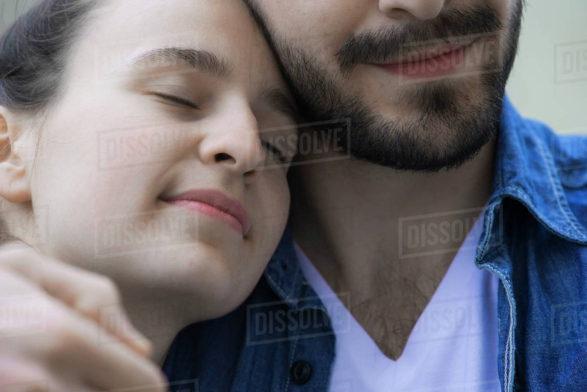 Young woman resting head on boyfriend's shoulder - Royalty-free Stock ...