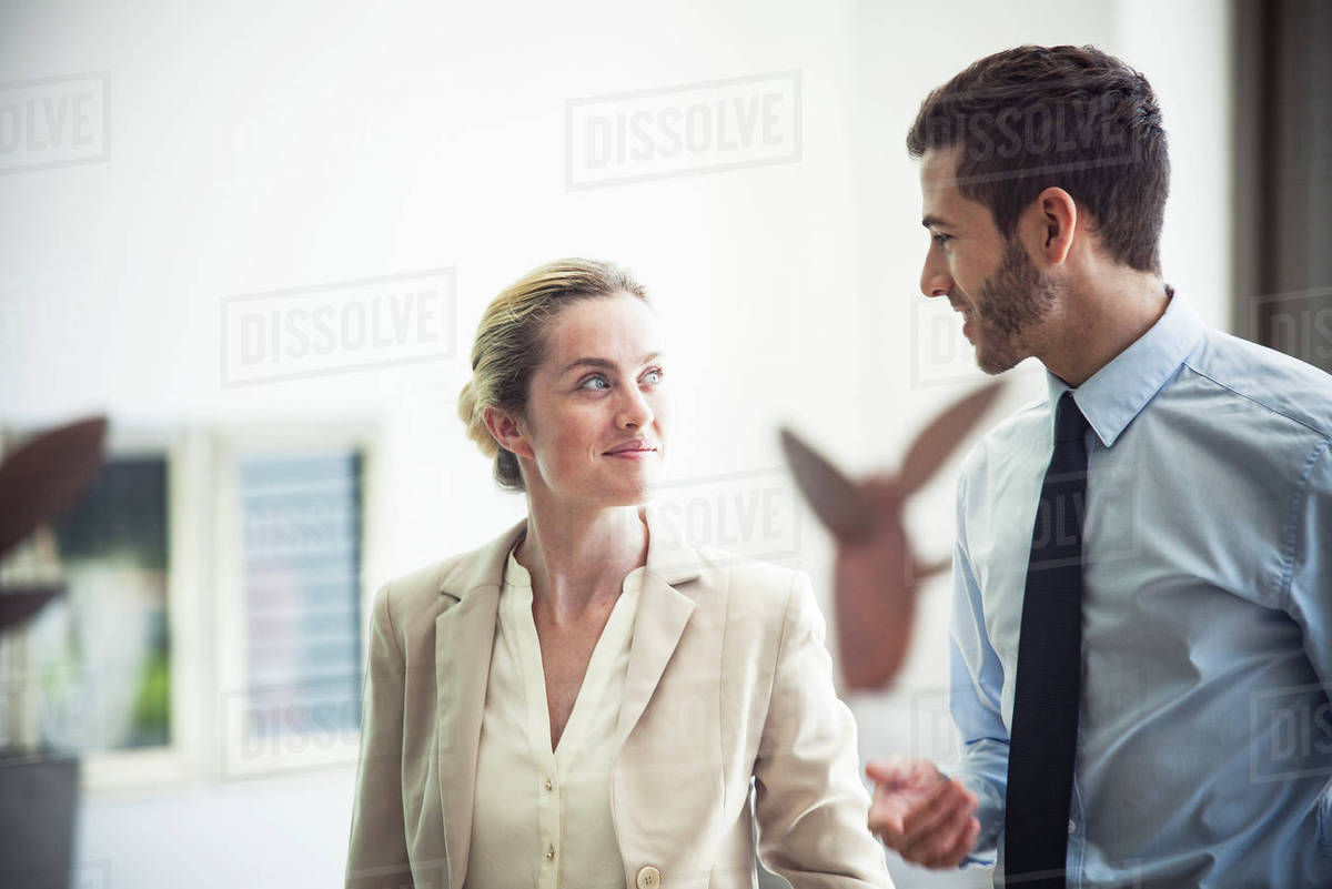 Business colleagues talking together in office - Royalty-free Stock ...