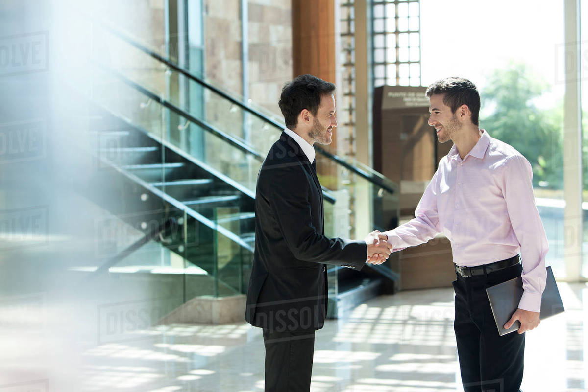 Business associates exchange greetings - Royalty-free Stock Photo ...