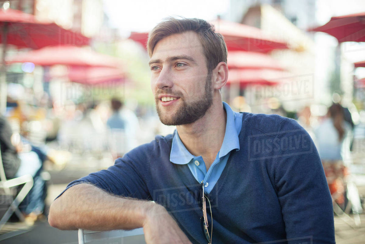 Man relaxing outdoors, portrait - Royalty-free Stock Photo | Dissolve