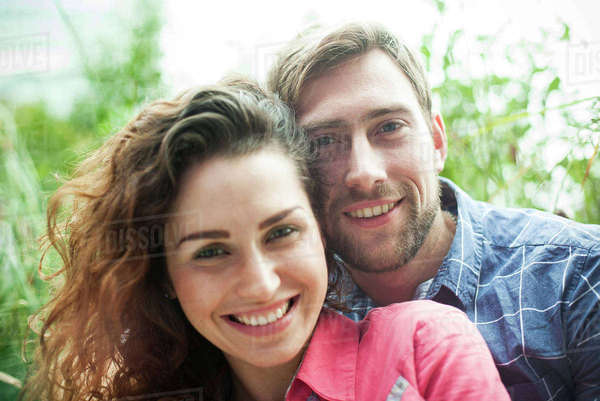 Couple together outdoors, portait - Stock Photo - Dissolve