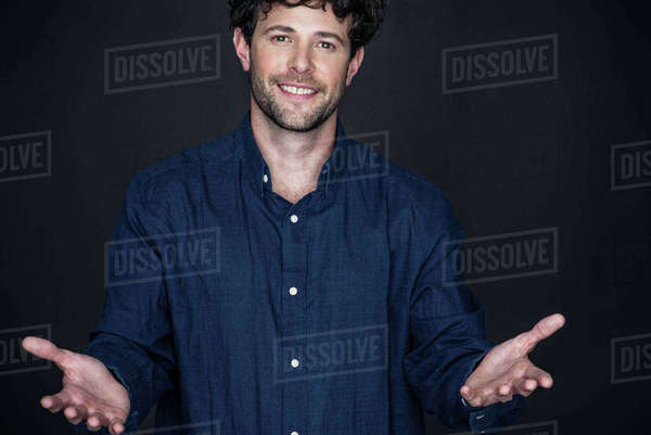 Man holding hands out in apologetic gesture - Royalty-free Stock Photo ...