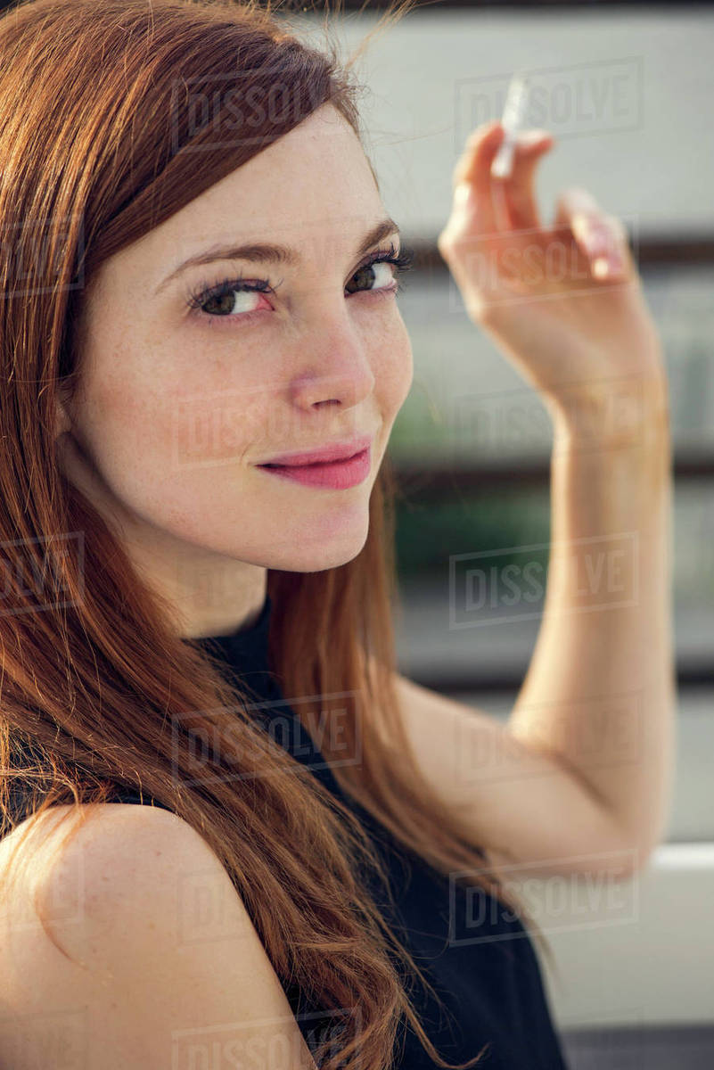 Woman smoking, portrait - Royalty-free Stock Photo | Dissolve