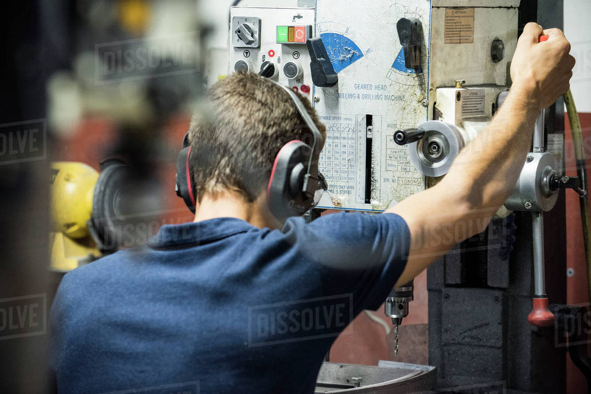 Machinist working in factory - Royalty-free Stock Photo | Dissolve
