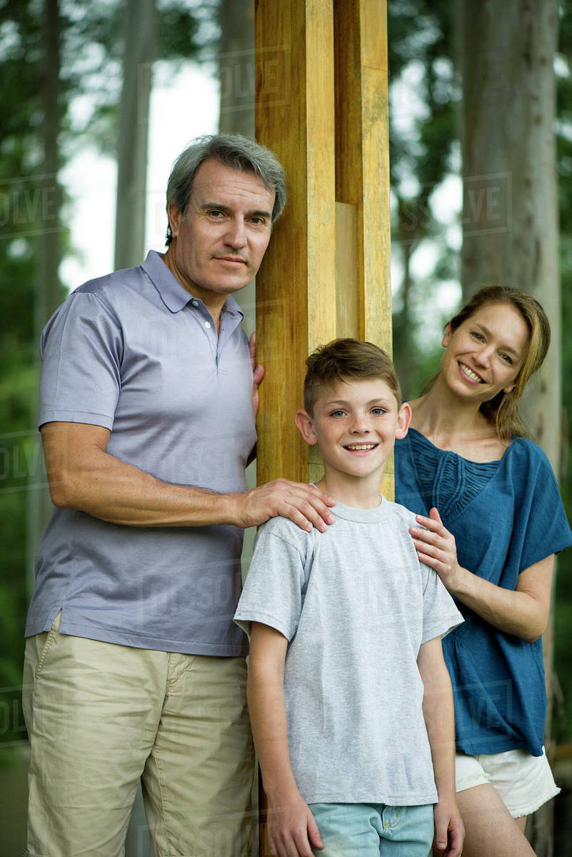 Family with one child, portrait - Stock Photo - Dissolve