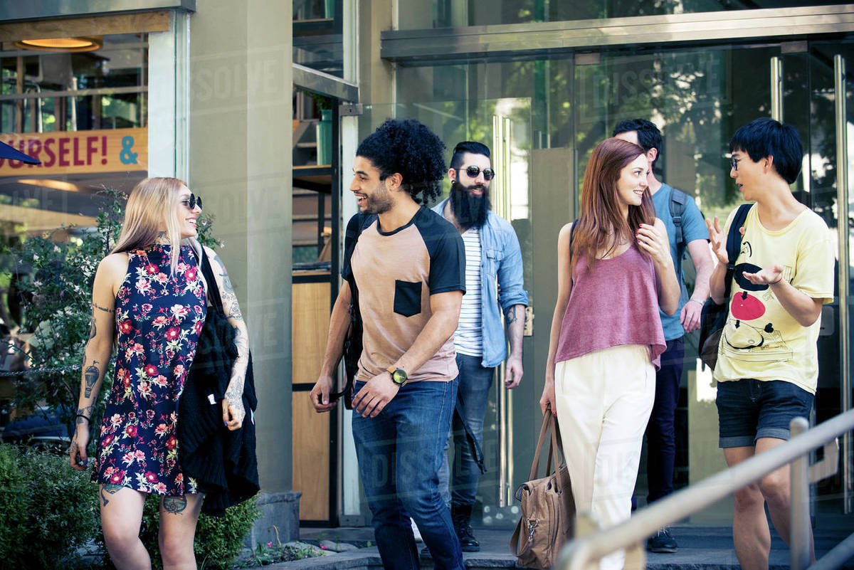College students walking together - Royalty-free Stock Photo | Dissolve