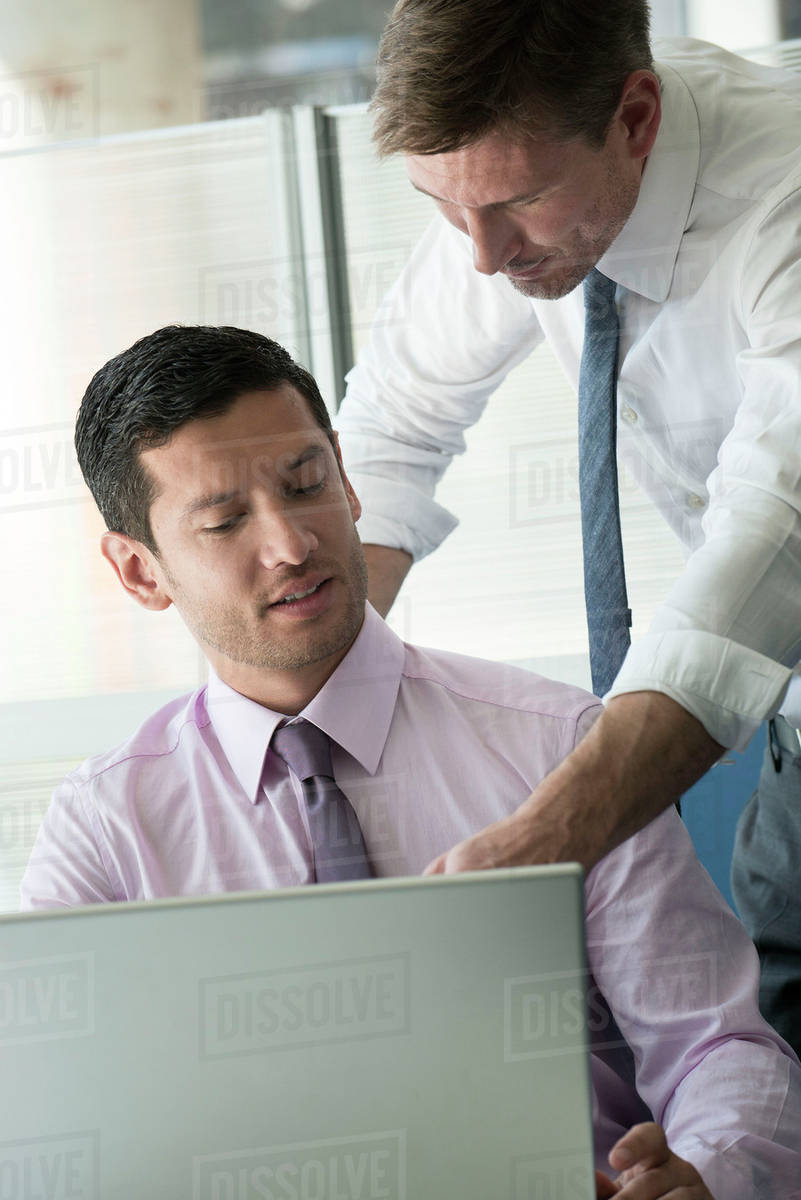 Colleagues collaborating on project - Stock Photo - Dissolve