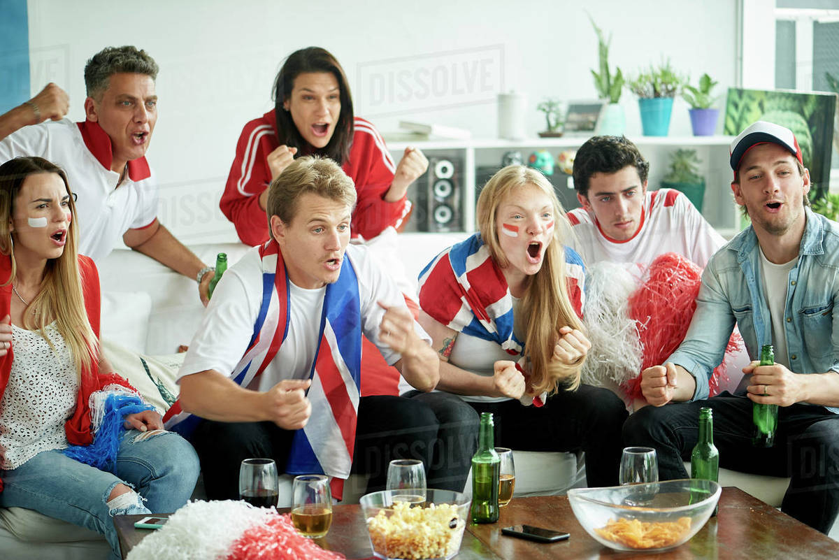 English soccer fans watching match together at home - Stock Photo ...