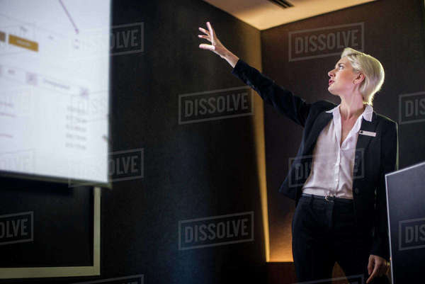 Woman giving presentation - Royalty-free Stock Photo | Dissolve