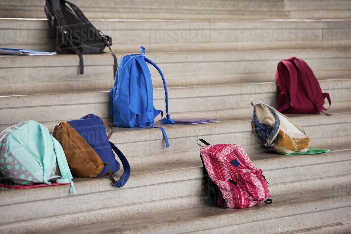 Backpacks left on bleachers - Royalty-free Stock Photo | Dissolve