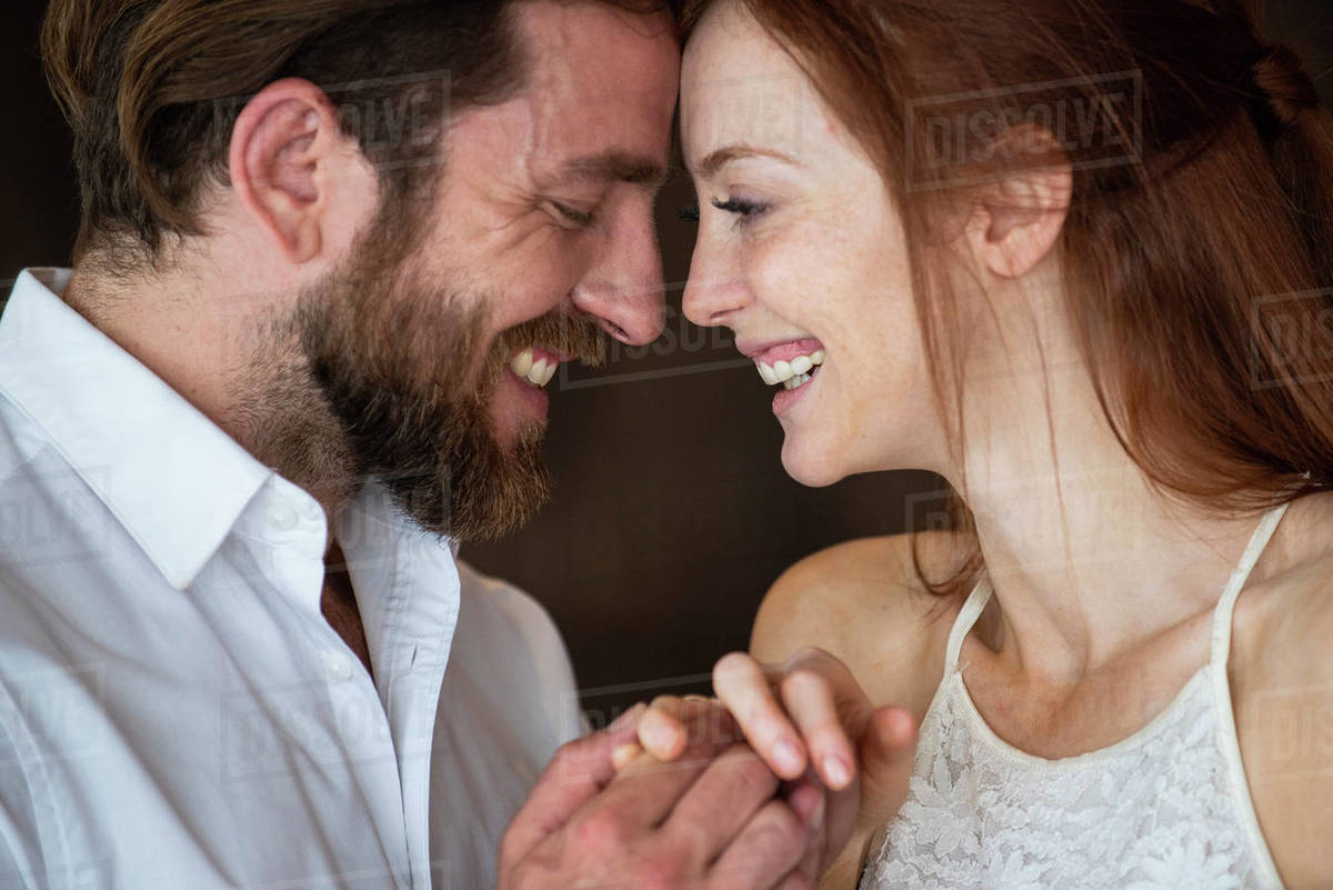 Close-up of couple touching heads - Royalty-free Stock Photo | Dissolve
