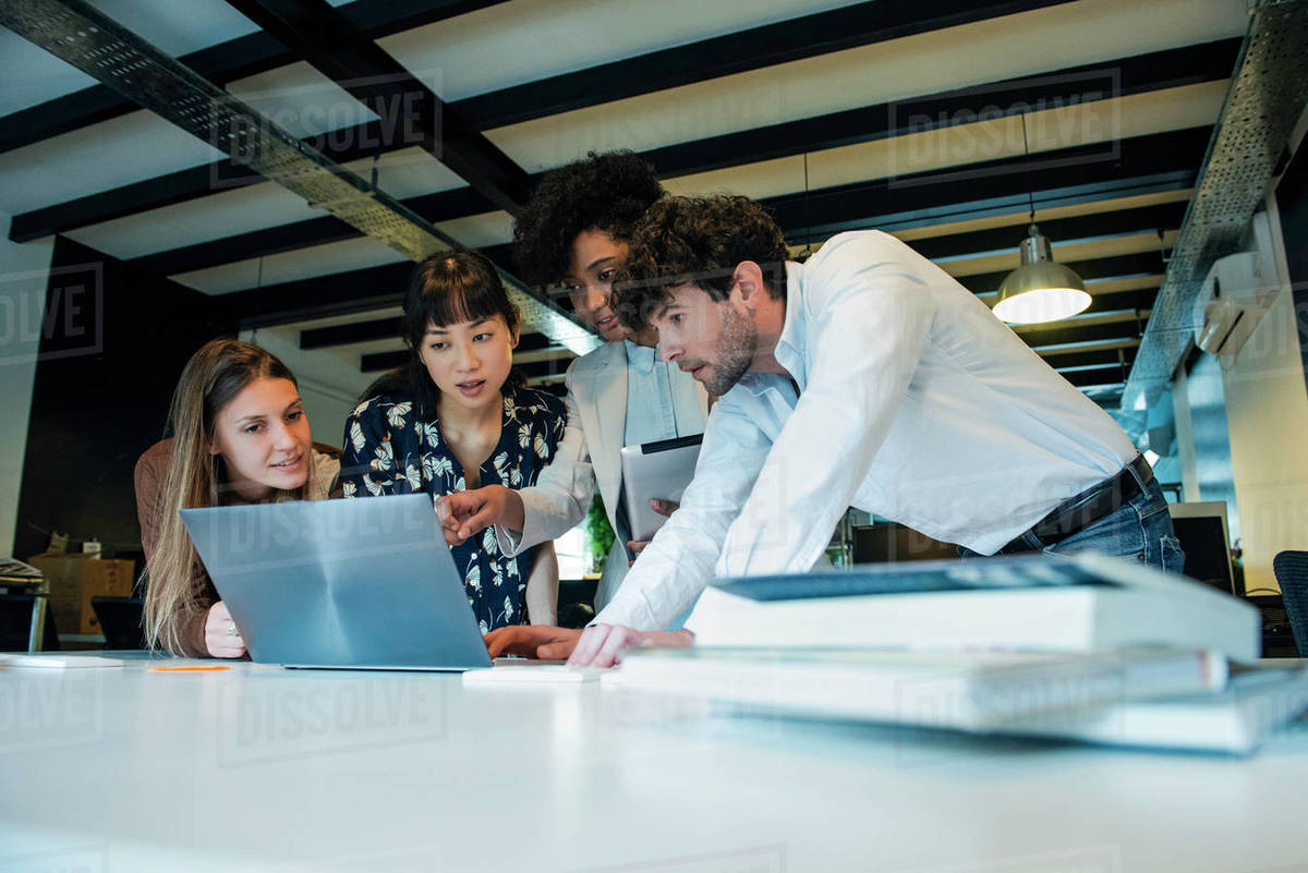 Business people using laptop in office - Royalty-free Stock Photo ...