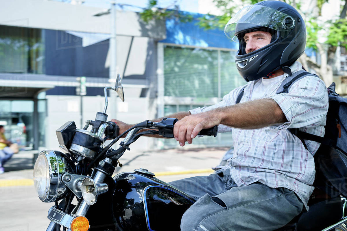 Man riding motorbike - Royalty-free Stock Photo | Dissolve