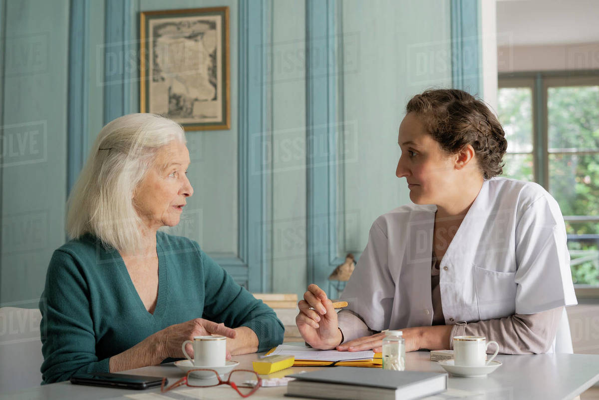 Patient talking with doctor - Royalty-free Stock Photo | Dissolve