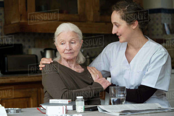 Nurse consoling patient - Stock Photo - Dissolve